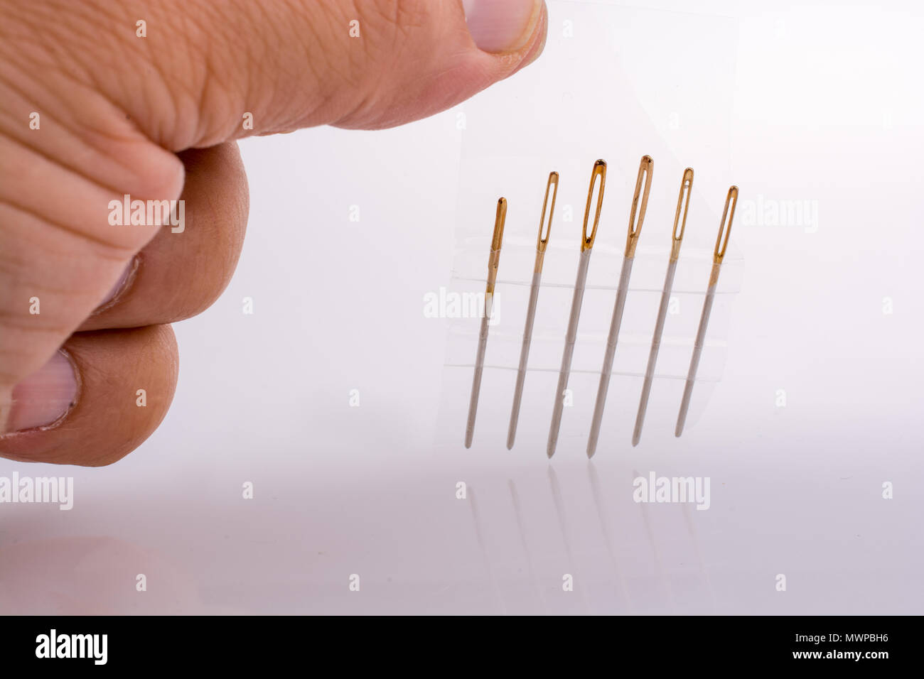 Six different sewing needles isolated on a white background Stock Photo ...
