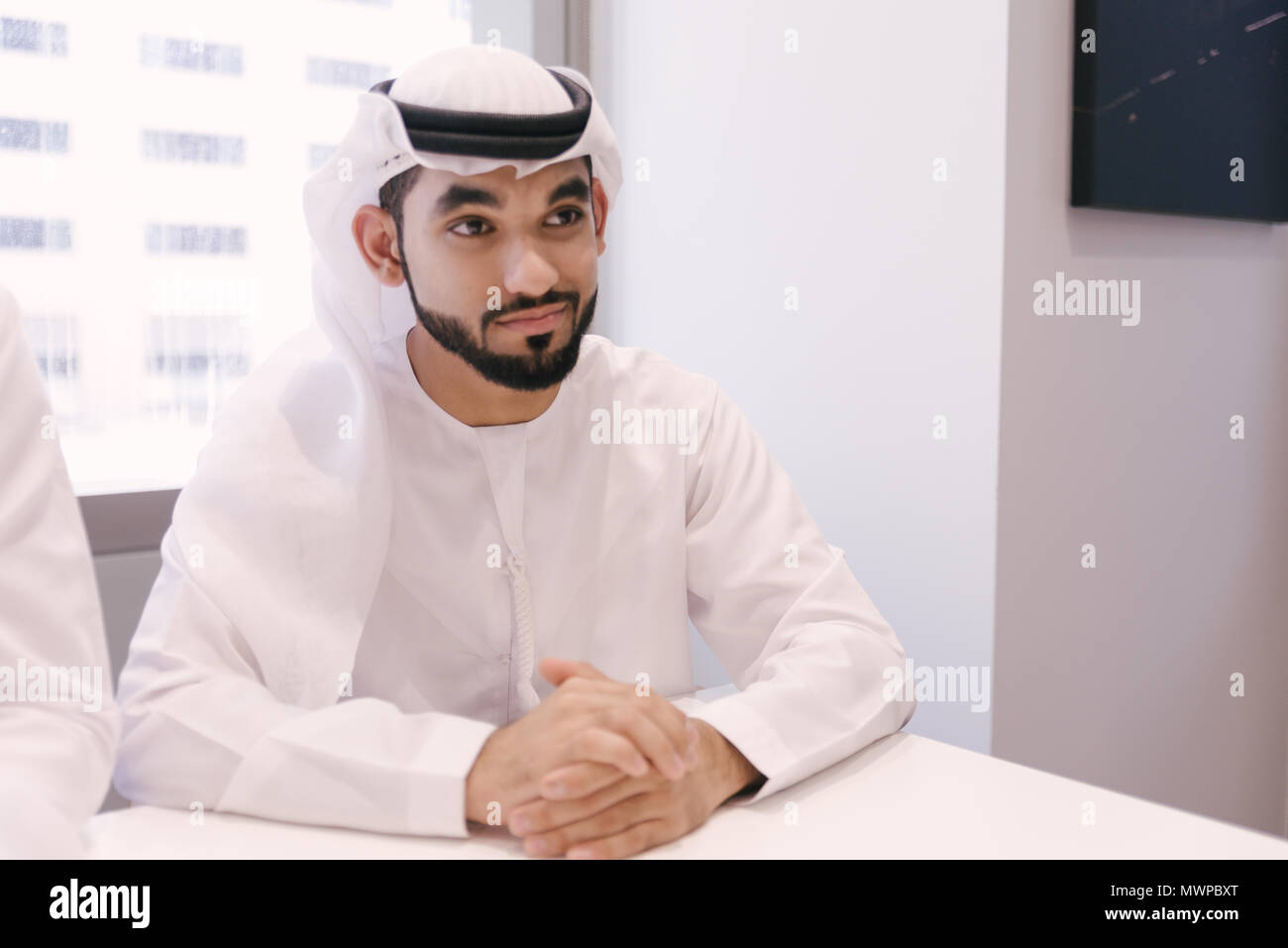 Emirati businessman looking at camera Stock Photo - Alamy