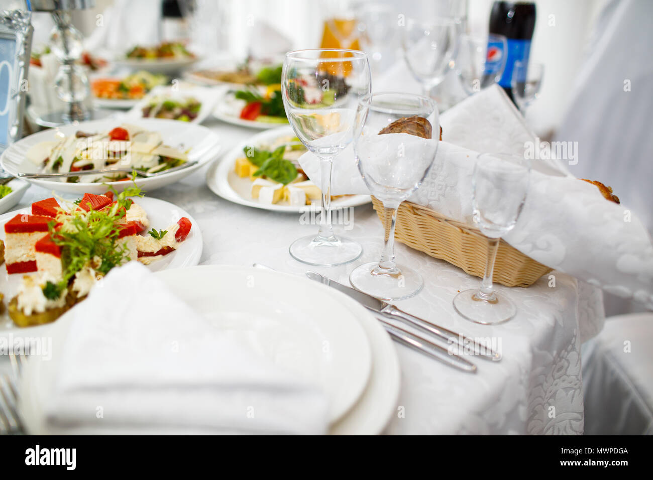 Catering table set service with silverware and glass stemware at ...