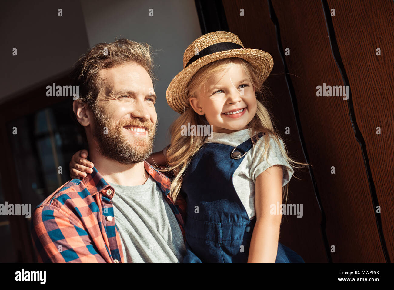 portrait of smiling father and daughter looking away Stock Photo - Alamy
