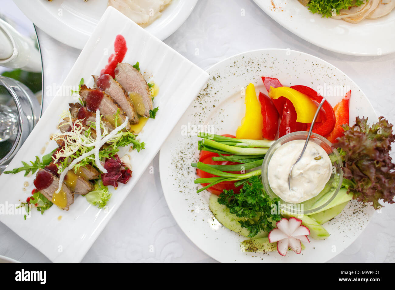Catering table set service with silverware and glass stemware at ...