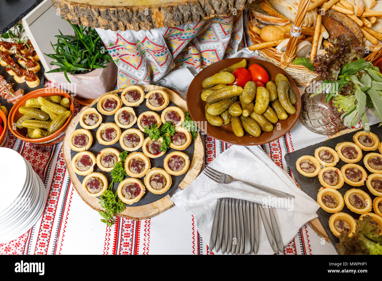 table with different type of snacks preparing for party Stock Photo - Alamy