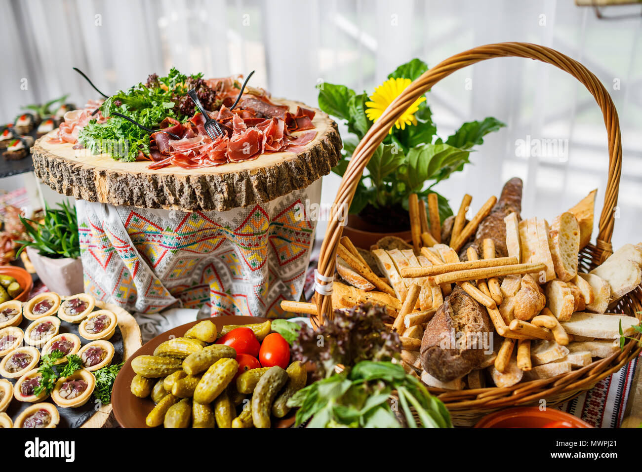 Beautifully decorated catering banquet table with different food snacks ...
