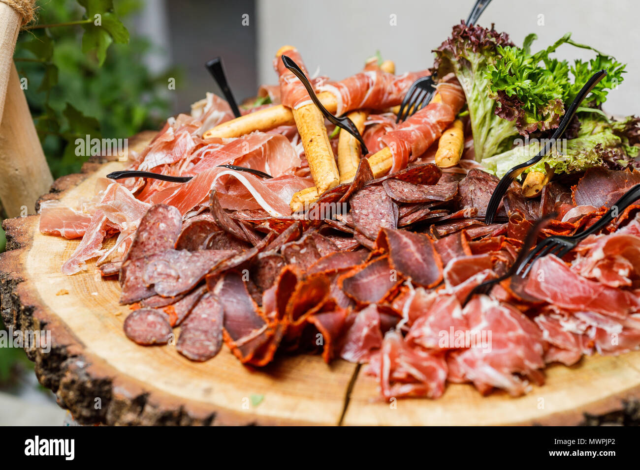 table with different type of snacks preparing for party Stock Photo - Alamy