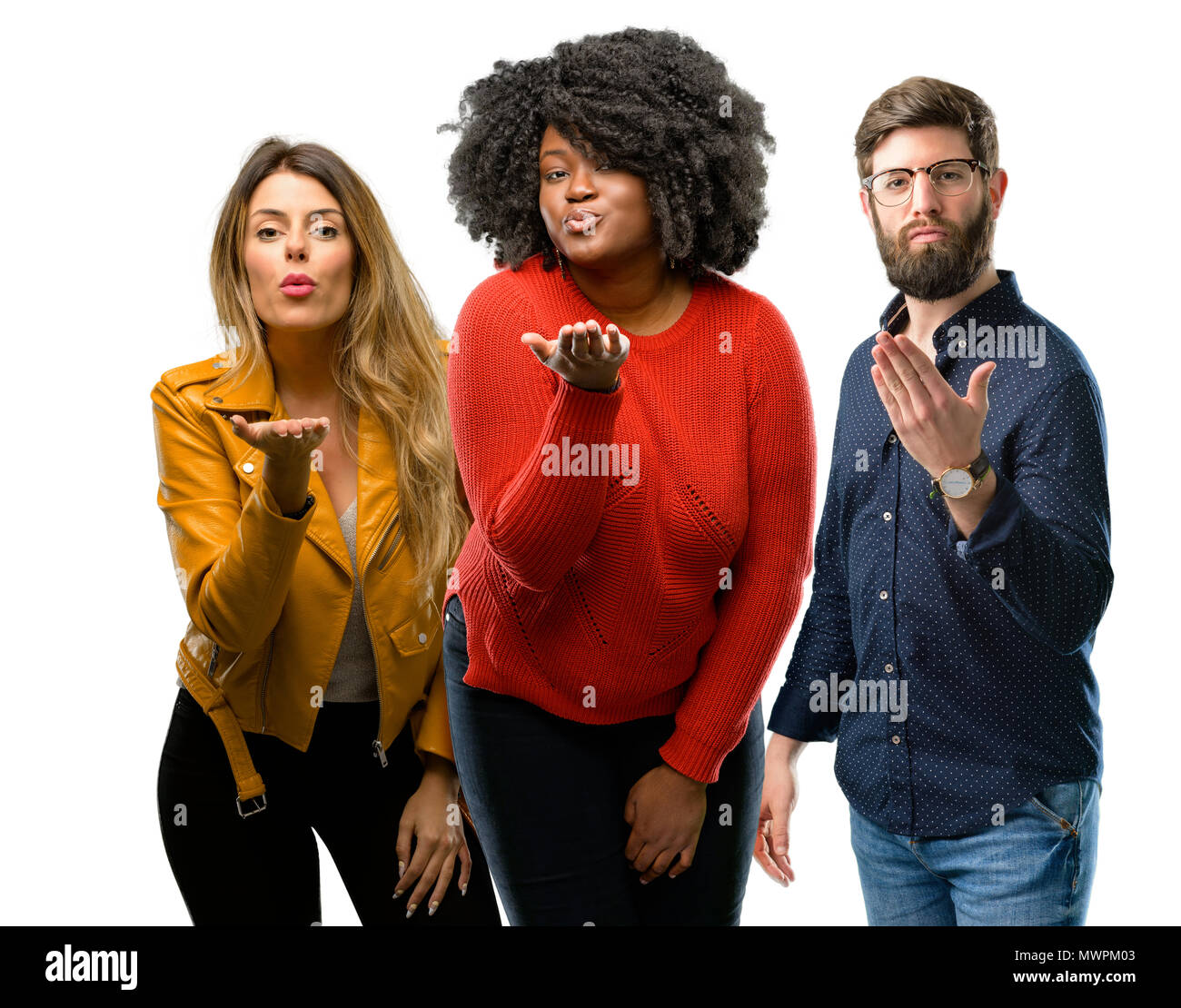 Group of three young men and women expressing love, blows kiss at ...