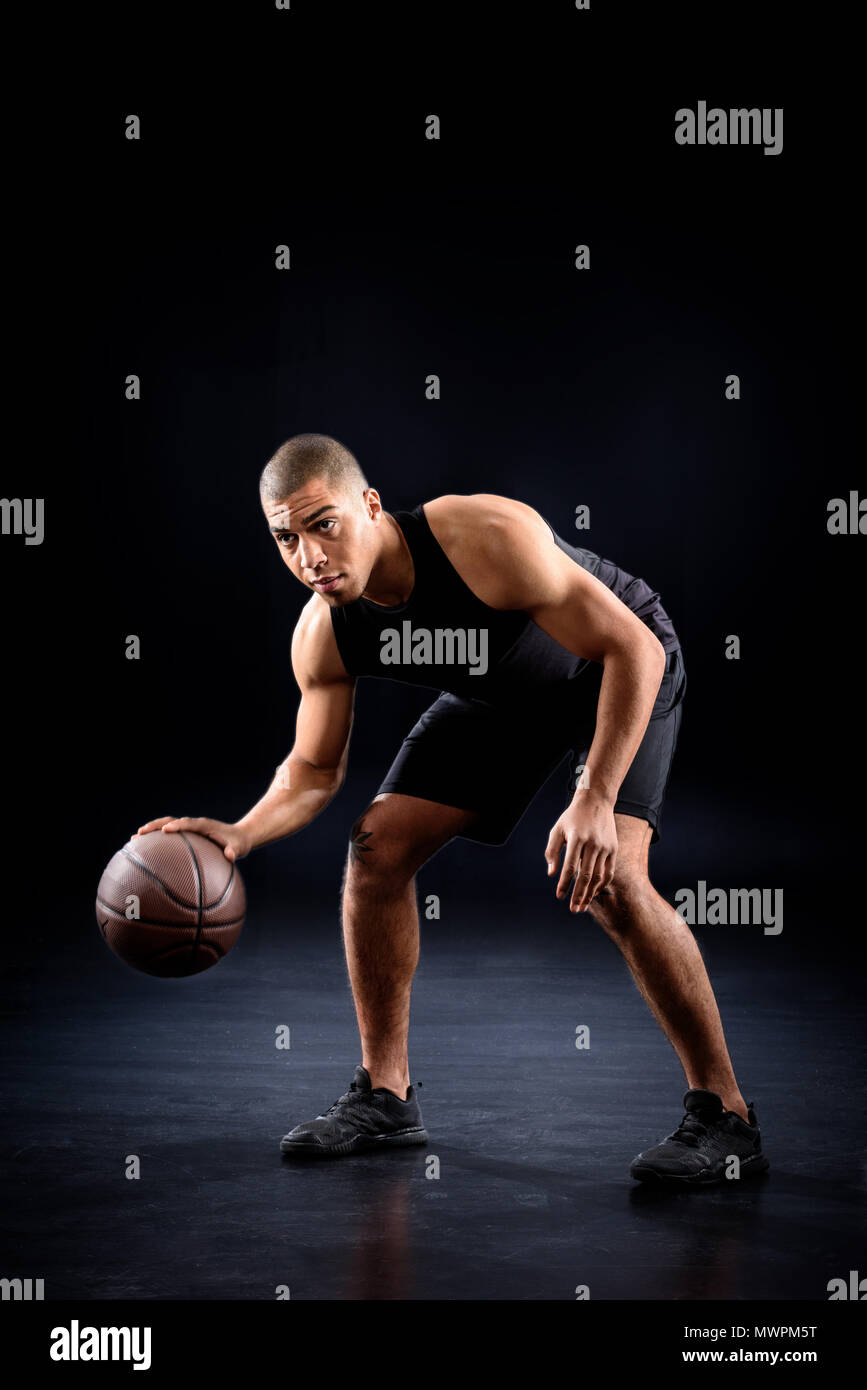 Basketball player bouncing ball hi-res stock photography and images - Alamy