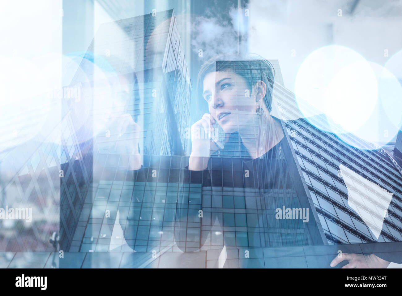 female manager using cell telephone in office interior Stock Photo - Alamy