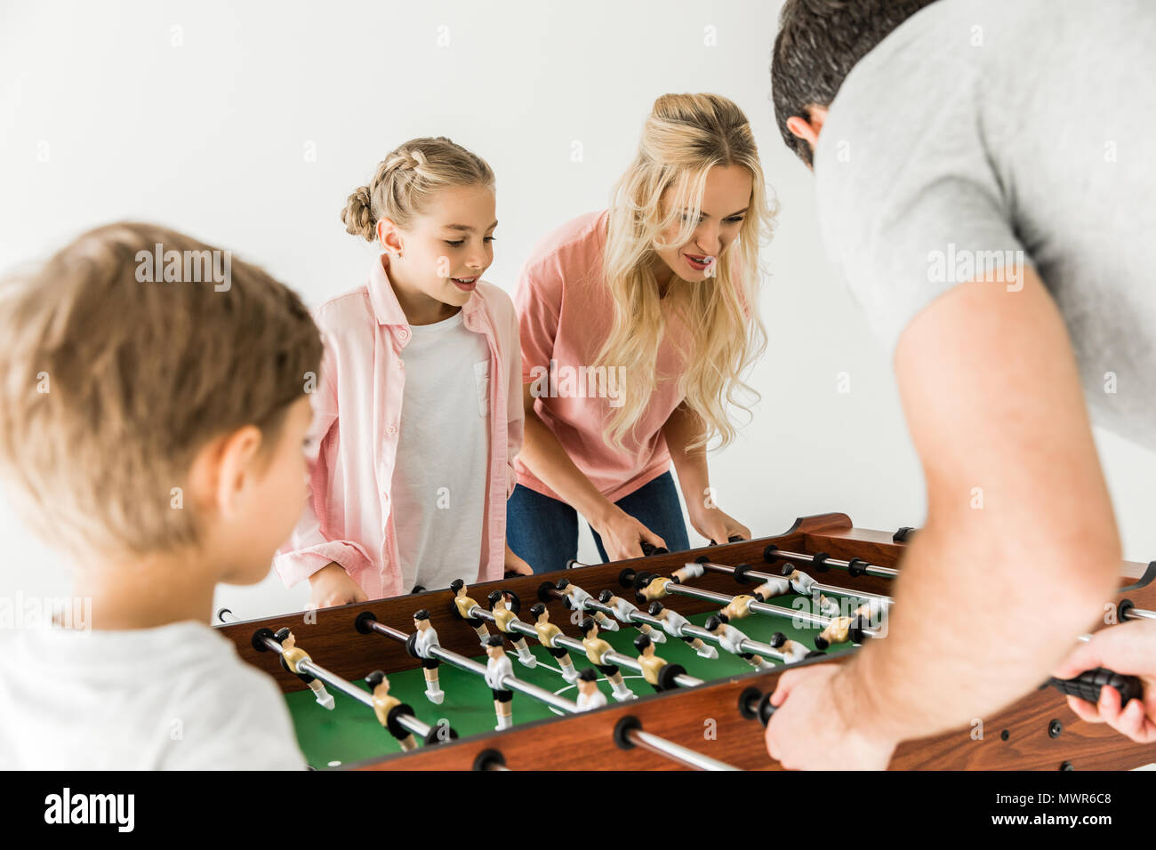 Isolated father playing football with son hi-res stock photography and ...
