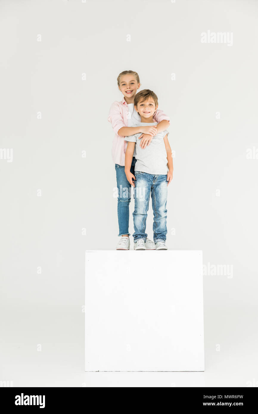 Brother sister standing together isolated hi-res stock photography and ...