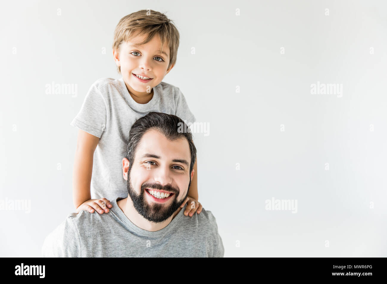 beautiful happy father and son smiling at camera isolated on white Stock Photo - Alamy