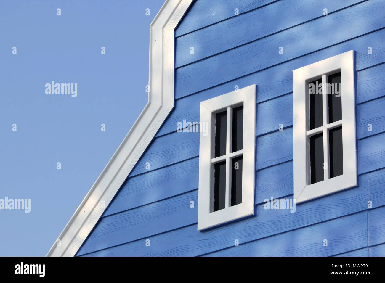 gable roof with white windows on wooden house Stock Photo - Alamy