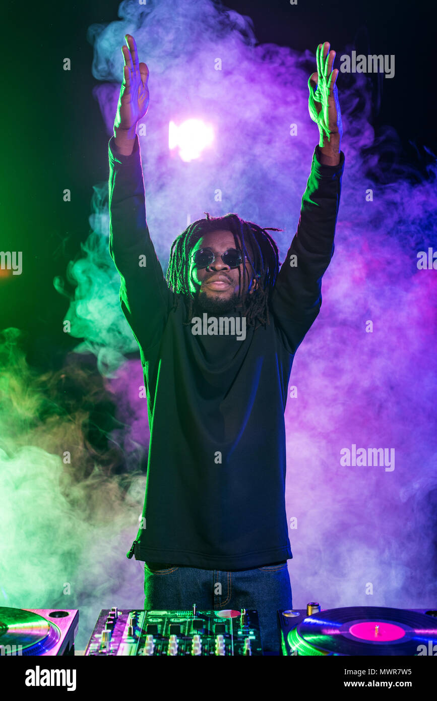 professional african american club DJ with sound mixer in nightclub ...