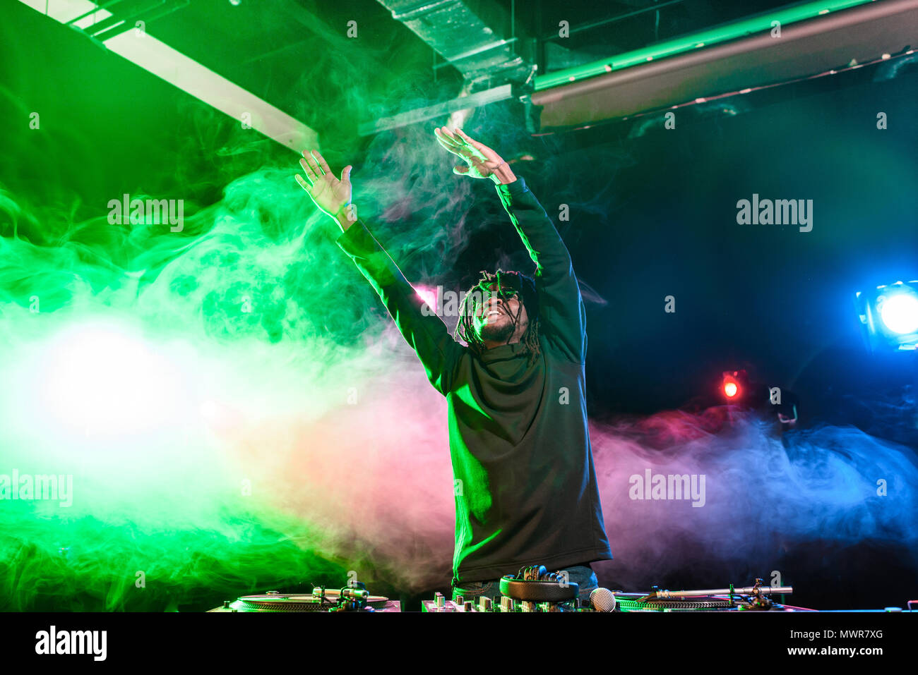 professional african american club DJ with mixer in nightclub Stock ...