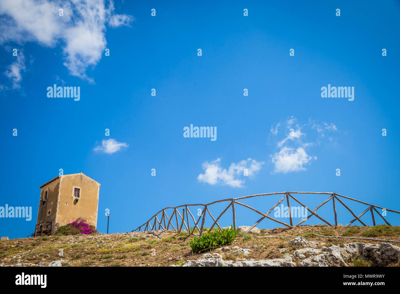 Traditional old Sicilian house during a sunny day with a wonderful blue ...