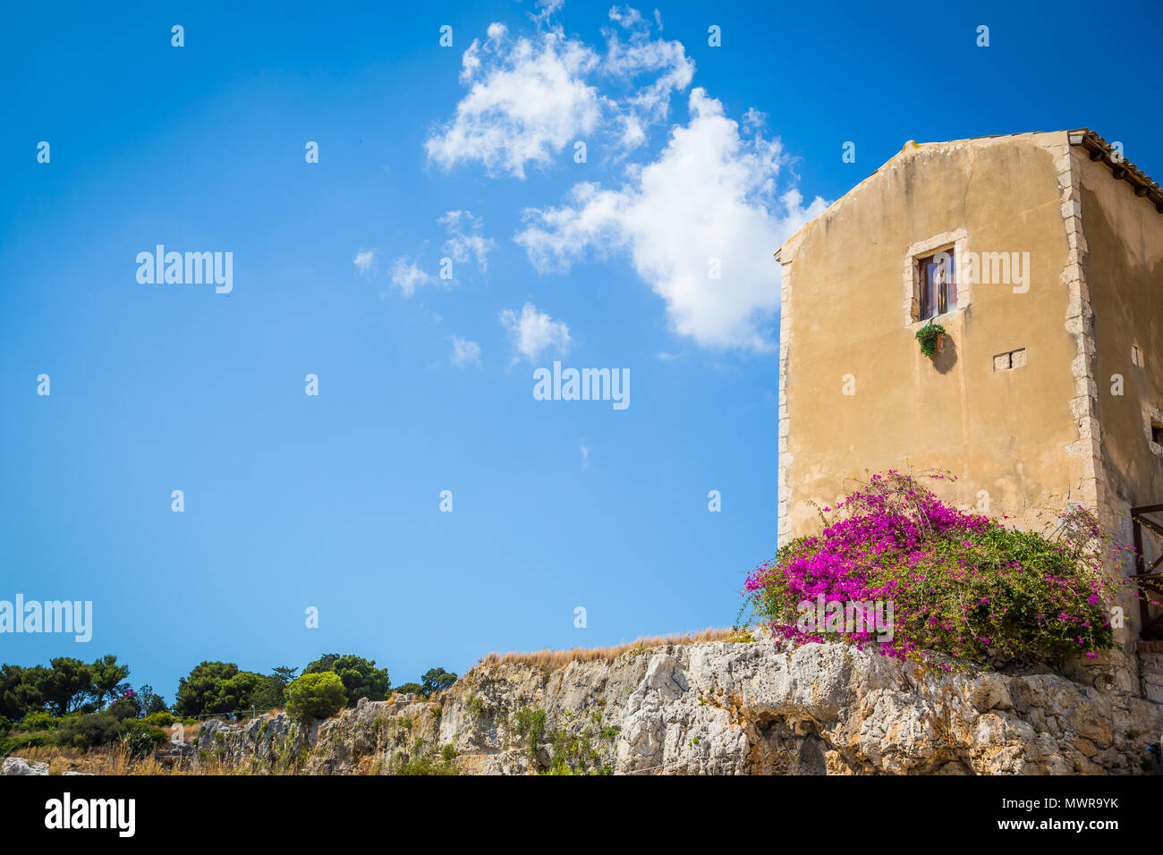 Traditional old Sicilian house during a sunny day with a wonderful blue ...