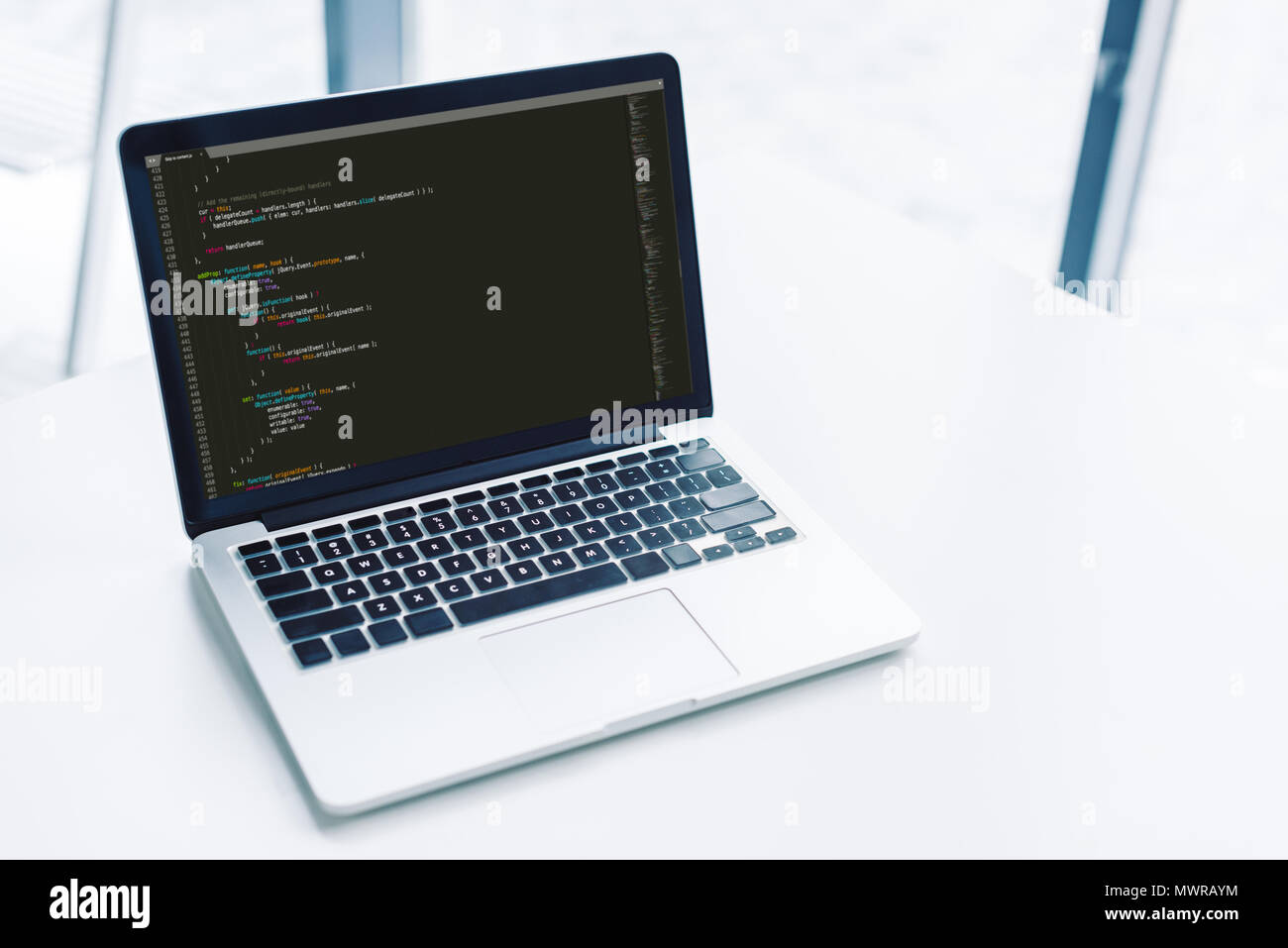 laptop with html code on white tabletop Stock Photo - Alamy