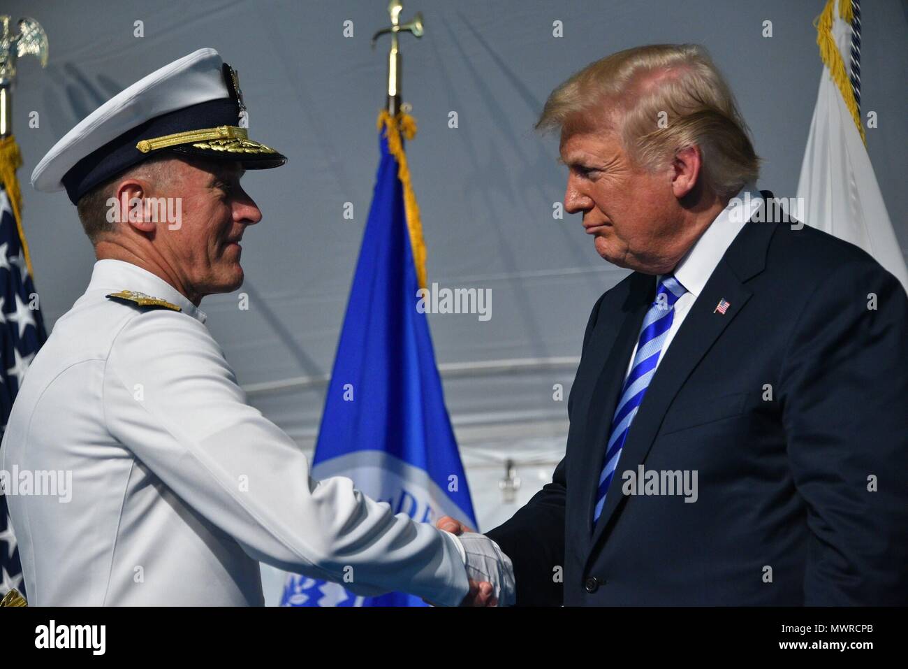 President Donald Trump congratulates Adm. Paul Zukunft during a change ...