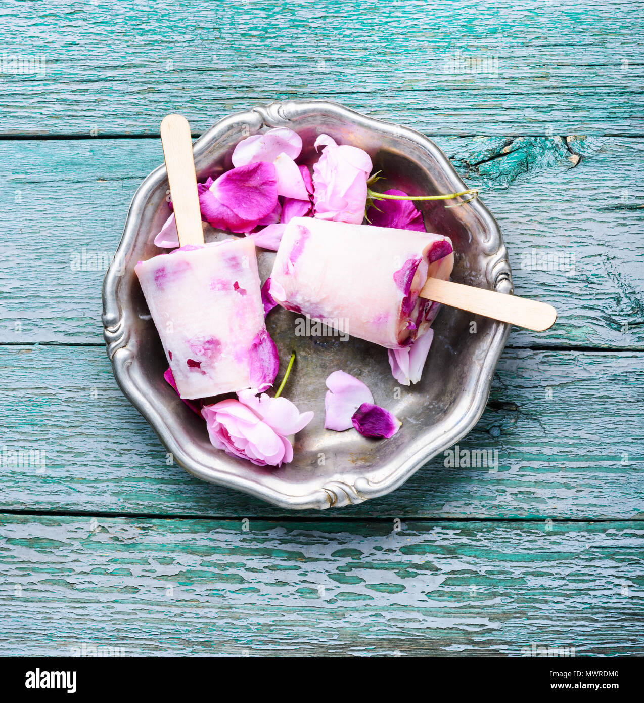 Summer vanilla ice cream with fresh rose flowers Stock Photo - Alamy