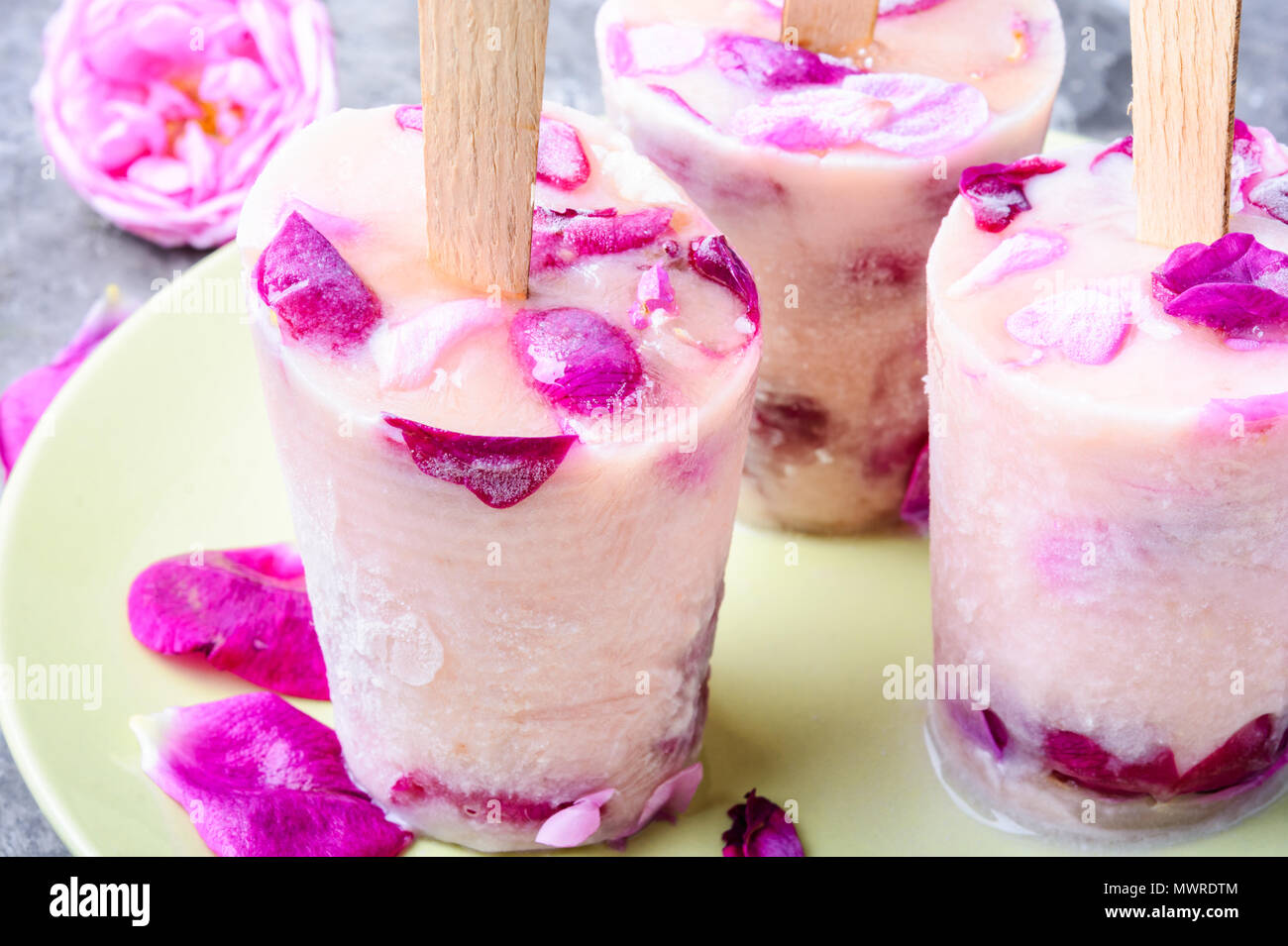 Summer vanilla ice cream with fresh rose flowers Stock Photo - Alamy