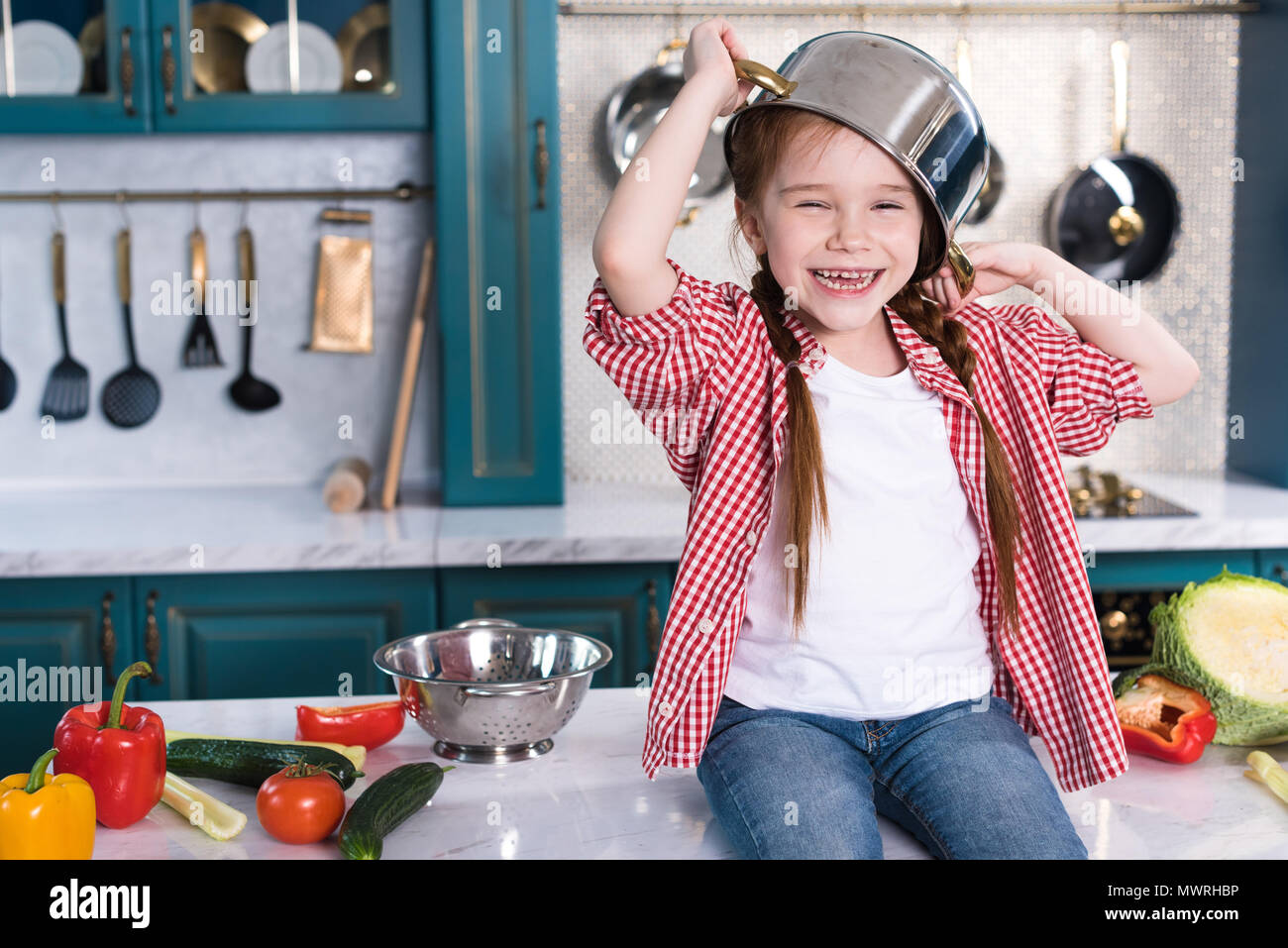 Girl with pan on head hi-res stock photography and images - Alamy