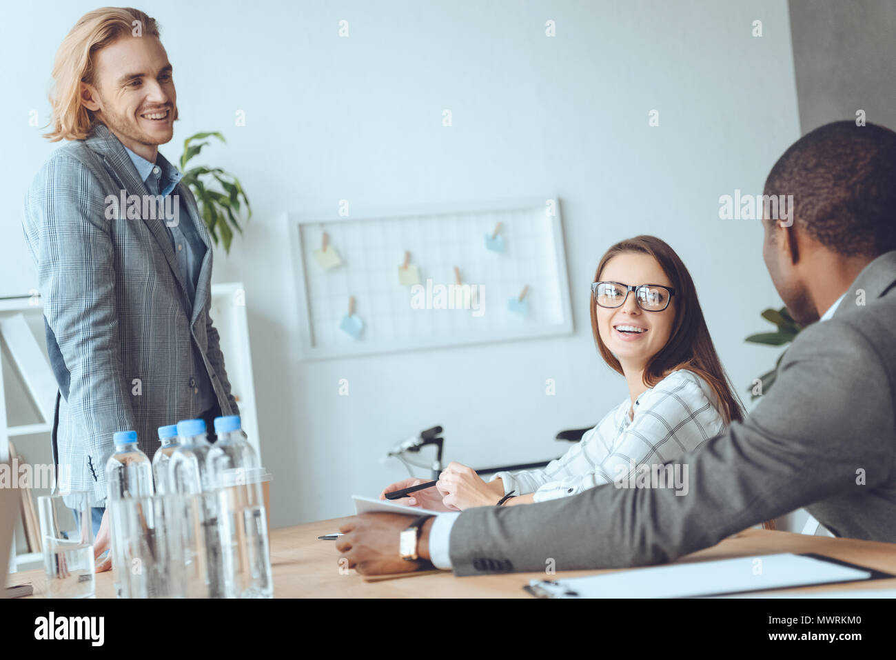 business team sitting at table and speaking at office space Stock Photo ...