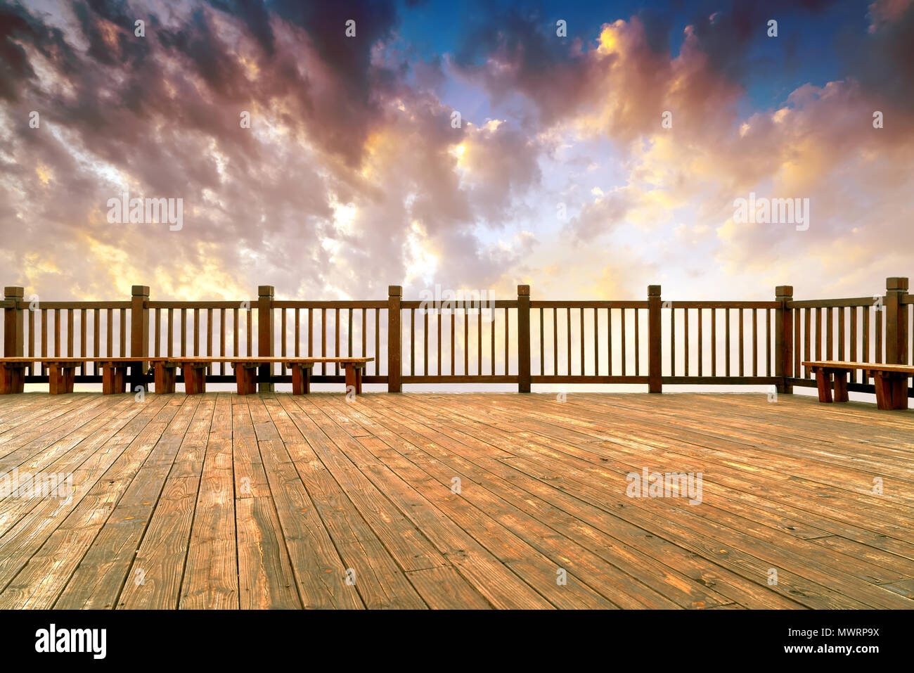 Wooden flooring and sunset/sunrise with clouds, light and other ...