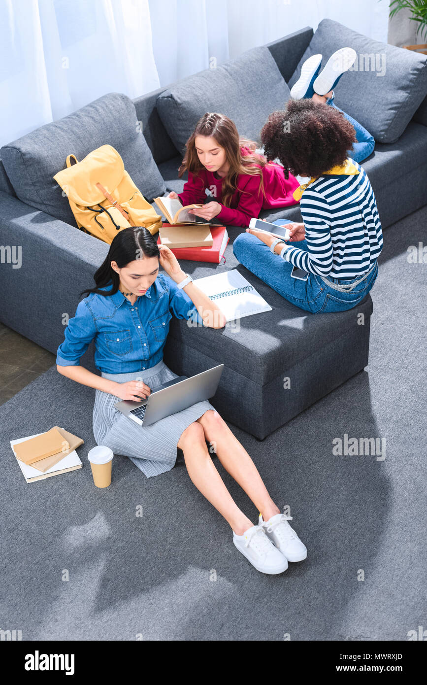 high angle view of multiethnic students doing homework together Stock ...