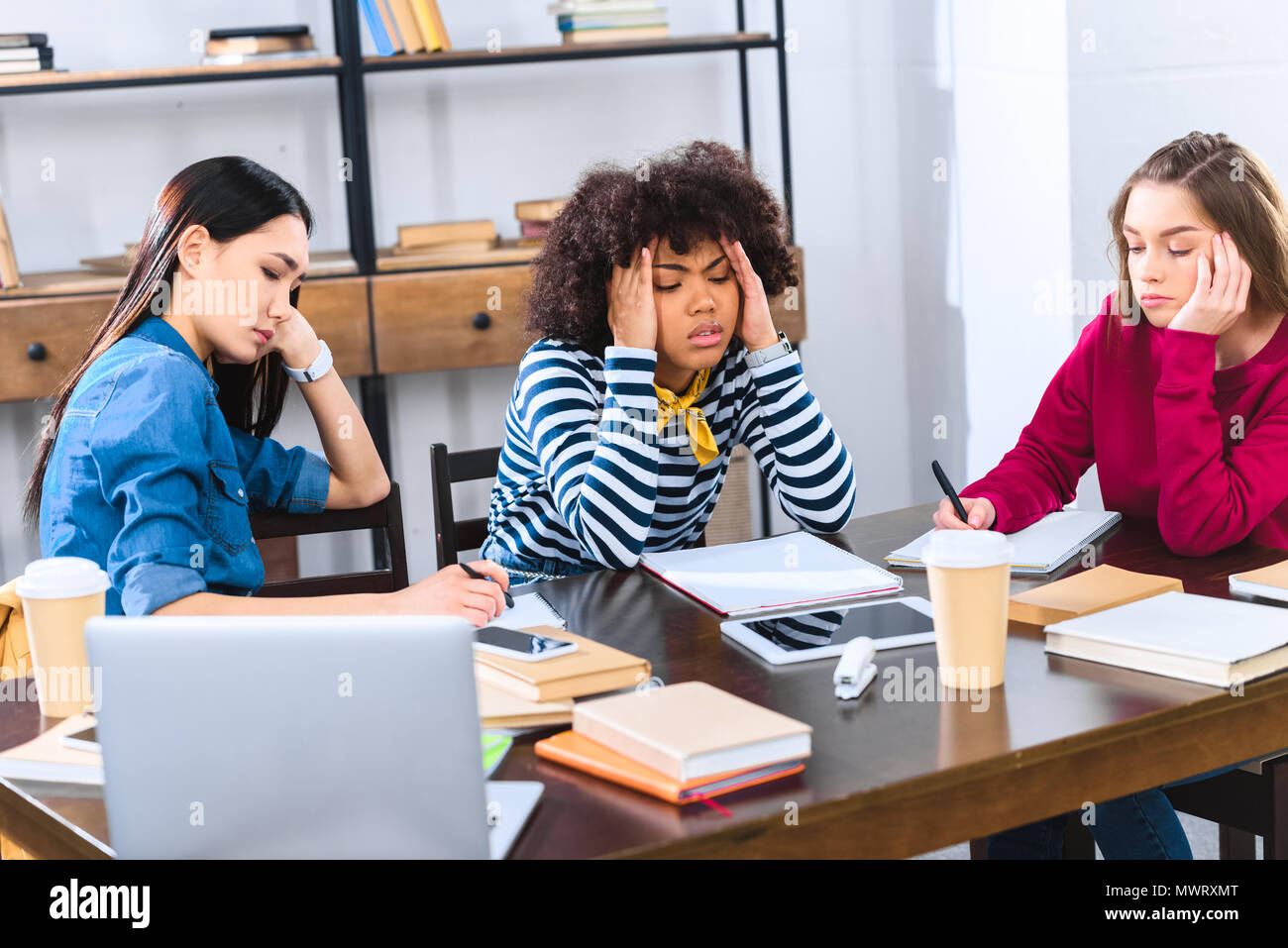 tired multiracial students doing homework together Stock Photo - Alamy tired multiracial students doing homework together Stock Photo - Alamy