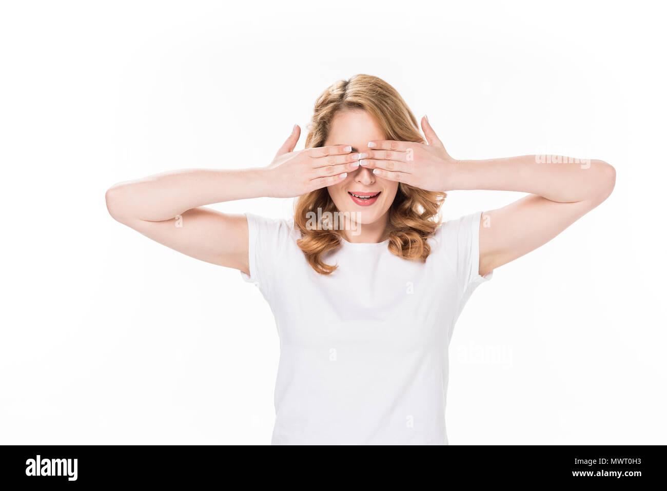 obscured view of caucasian woman covering eyes with hands isolated on ...