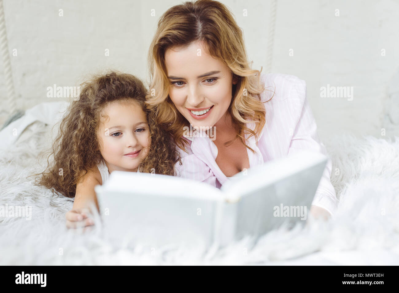 Charming mother daughter reading hi-res stock photography and images - Alamy