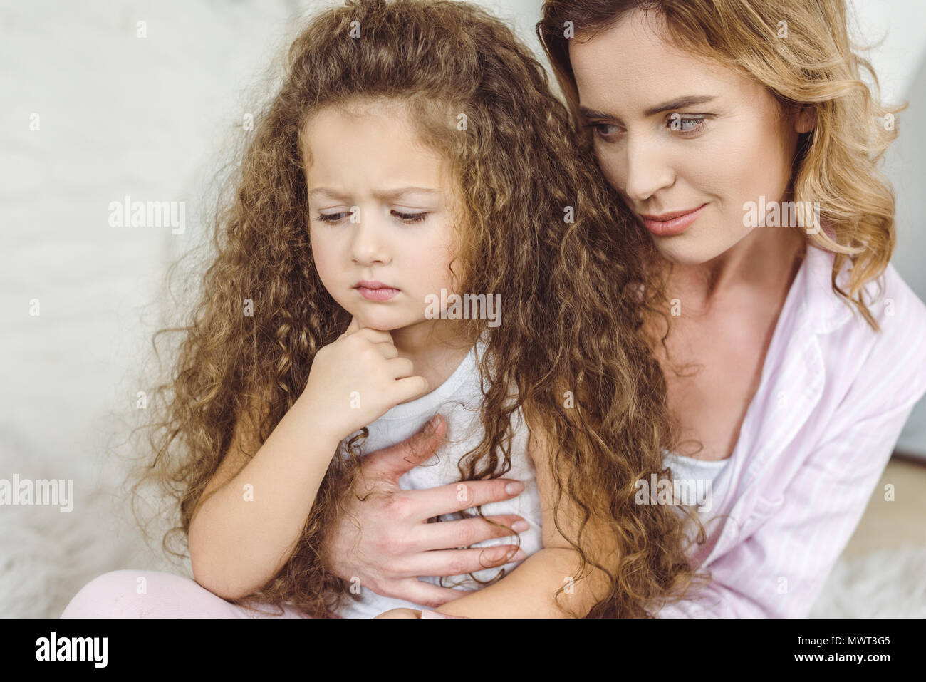 Mother hugging daughter sad hi-res stock photography and images - Alamy