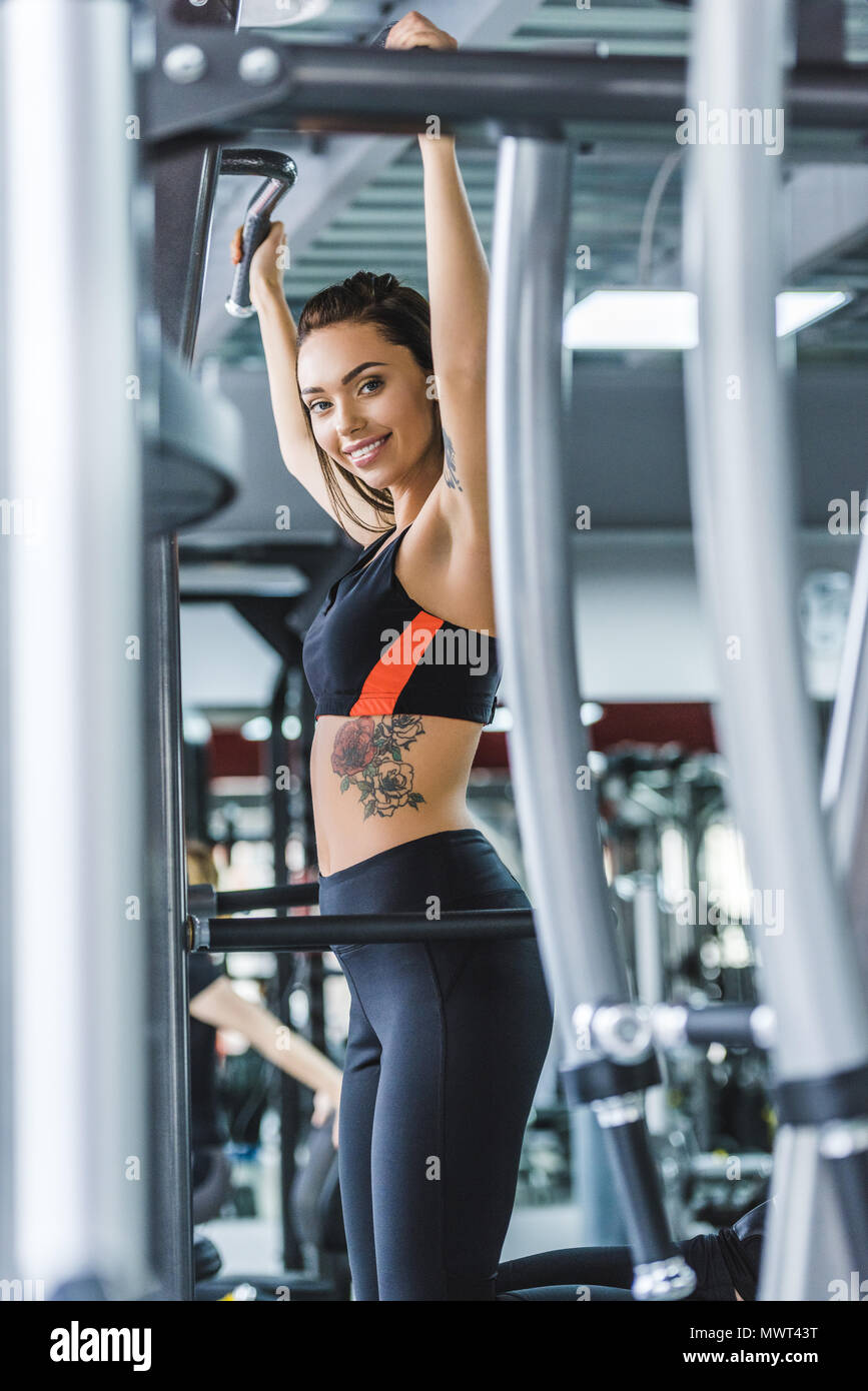Woman doing pull ups at gym hi-res stock photography and images - Alamy