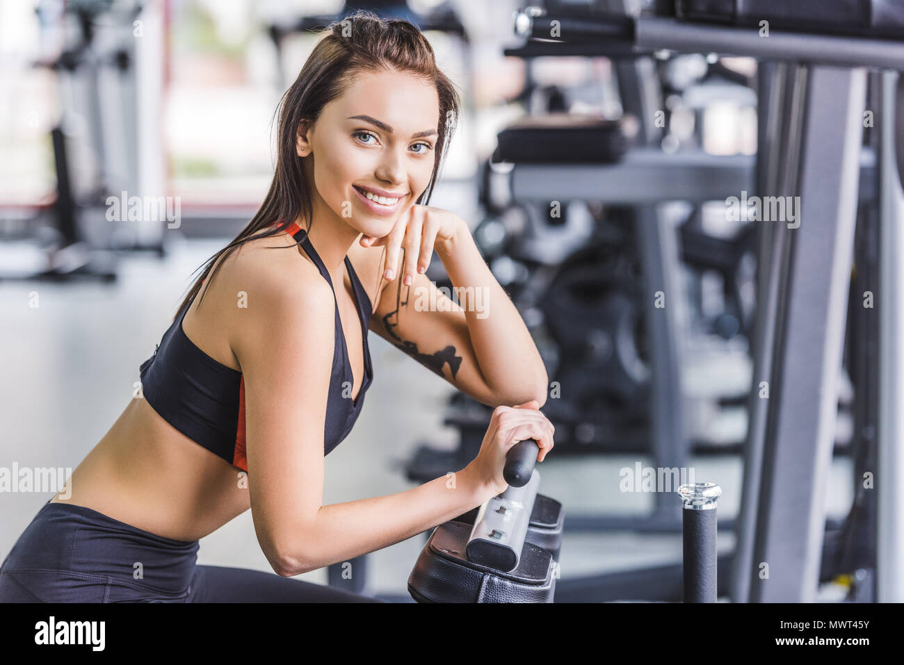 young attractive woman relaxing at gym after workout Stock Photo - Alamy