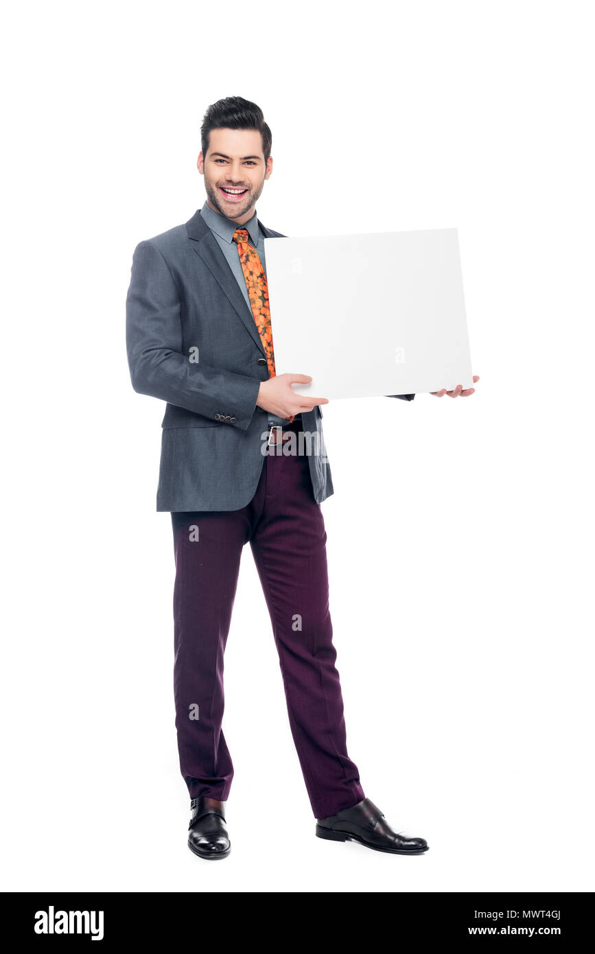 smiling businessman in suit holding blank placard, isolated on white ...