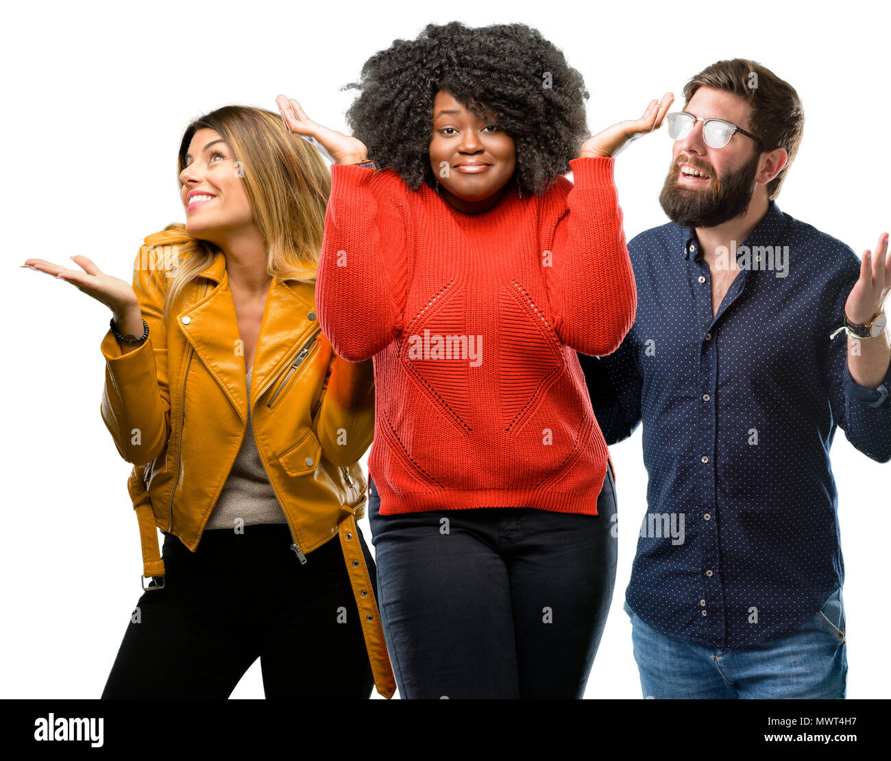 Group of three young men and women doubt expression, confuse and wonder ...