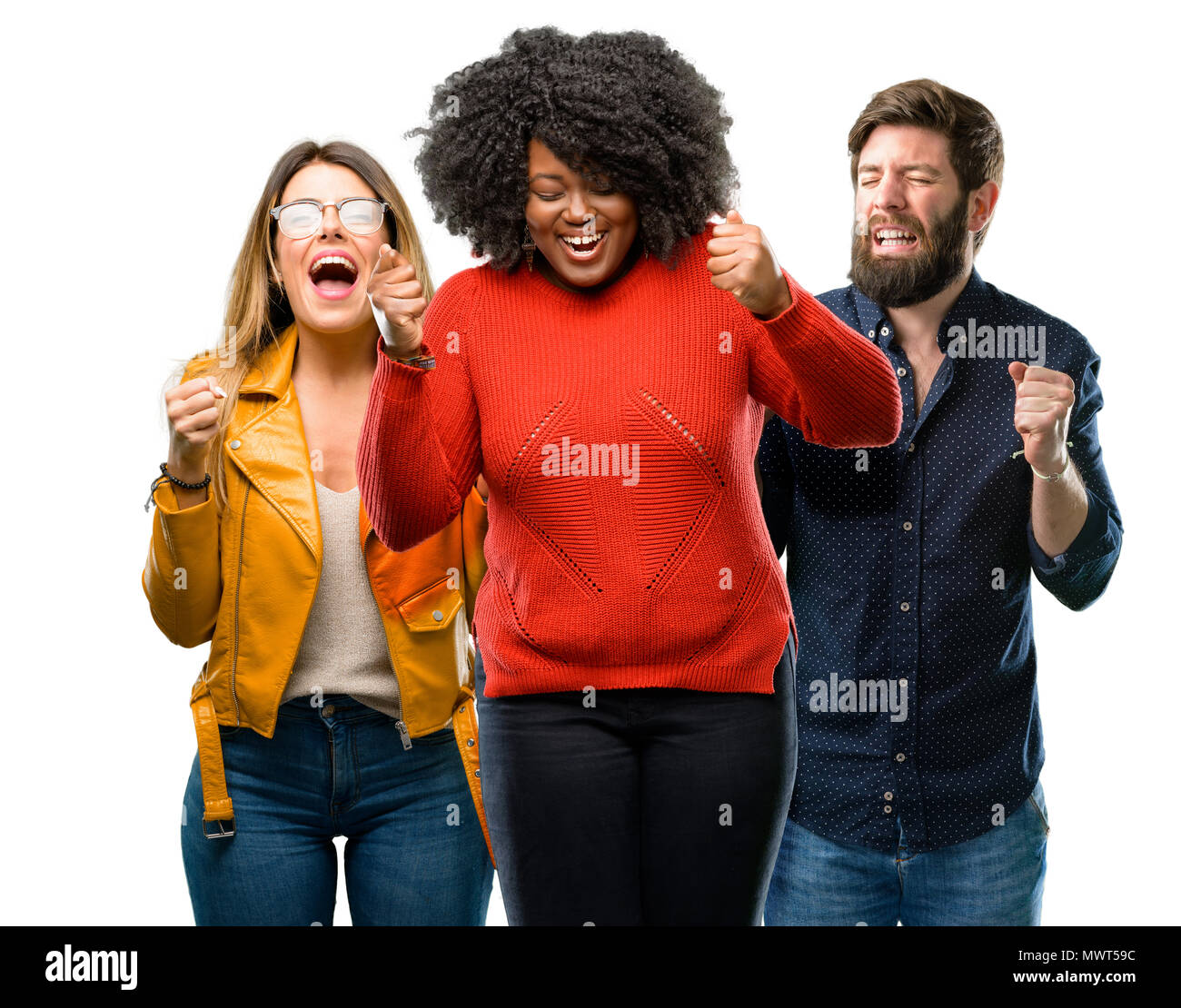 Group of three young men and women happy and surprised cheering ...