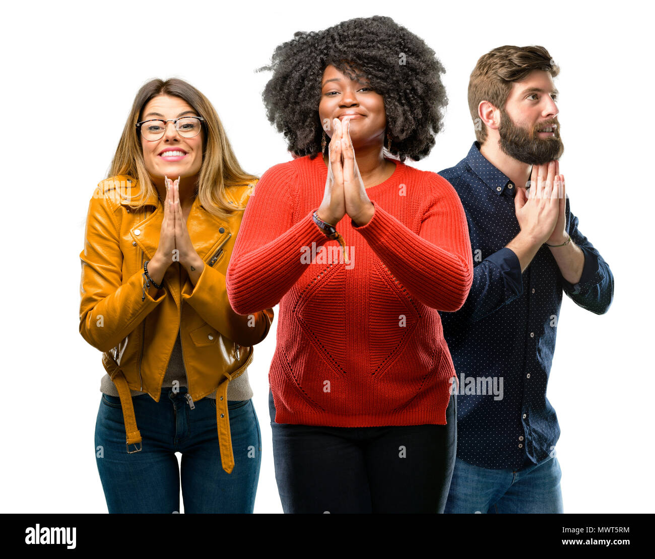 Group of three young men and women with hands together in praying ...