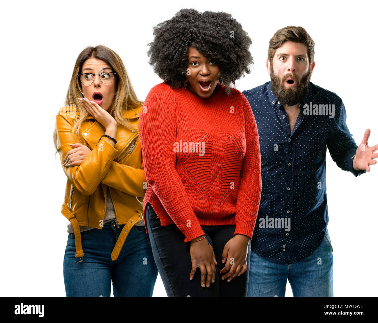 Group of three young men and women happy and surprised cheering ...