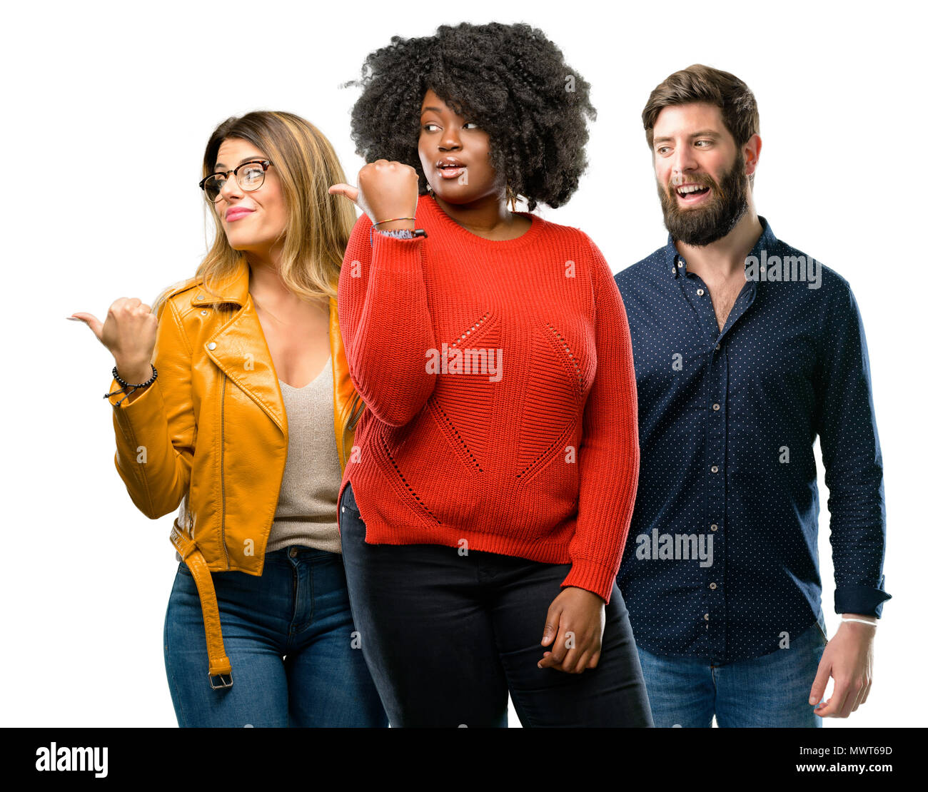 Group of three young men and women pointing away side with finger Stock ...