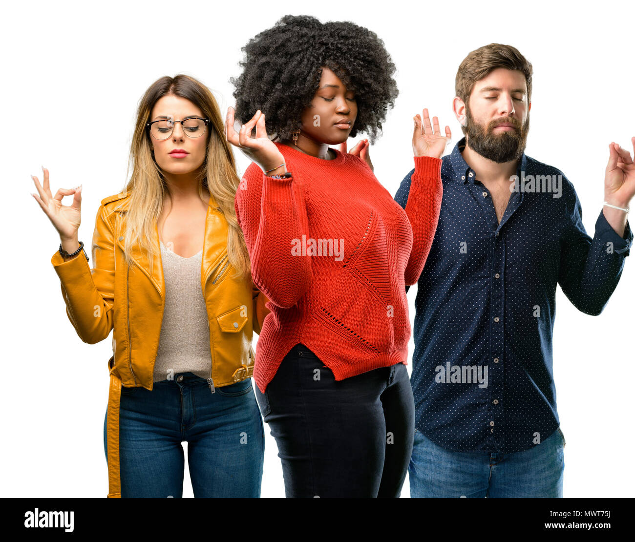 Group of three young men and women doing ok sign gesture with both ...