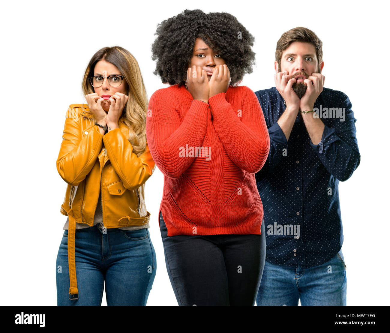 Group of three young men and women terrified and nervous expressing ...