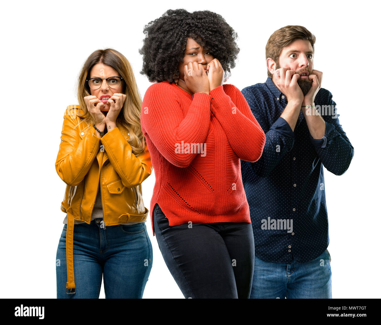 Group of three young men and women terrified and nervous expressing ...