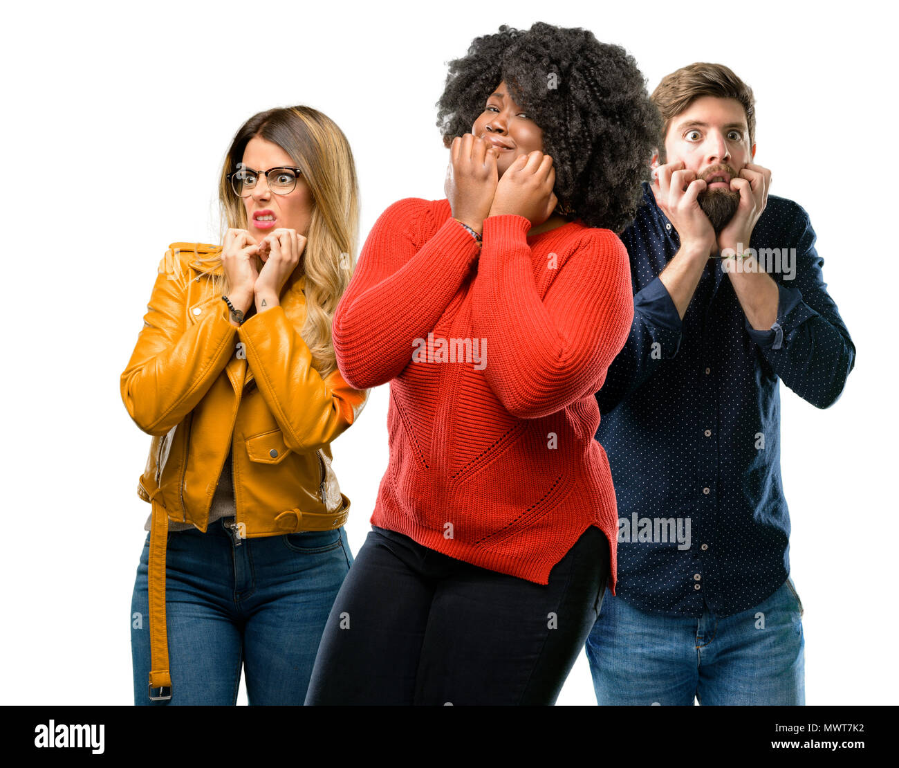 Group of three young men and women terrified and nervous expressing ...