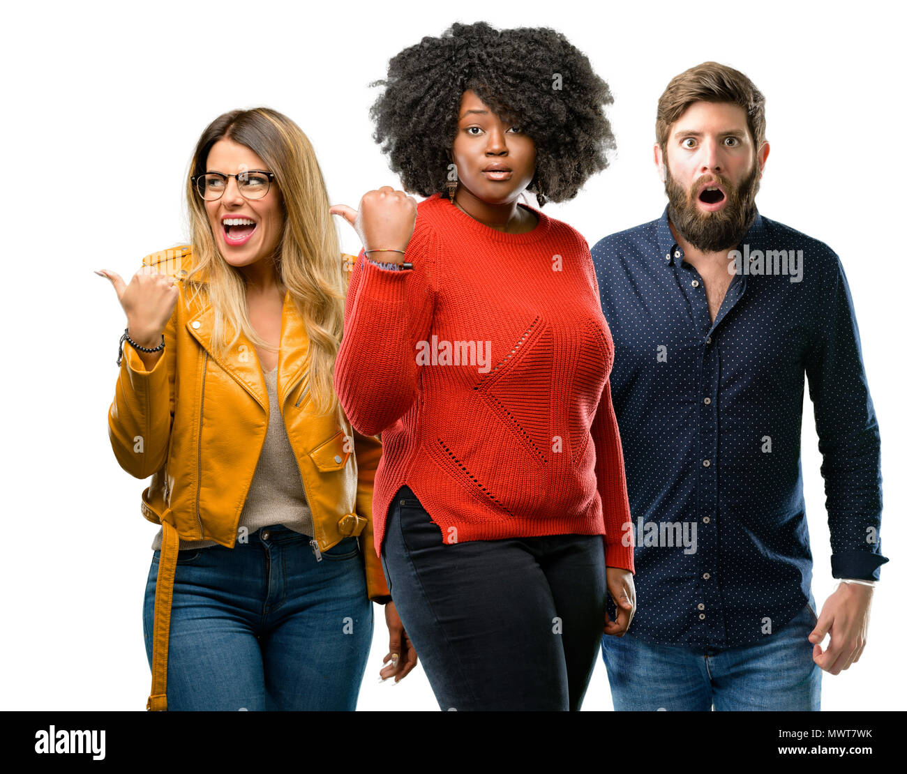 Group of three young men and women happy and surprised cheering ...