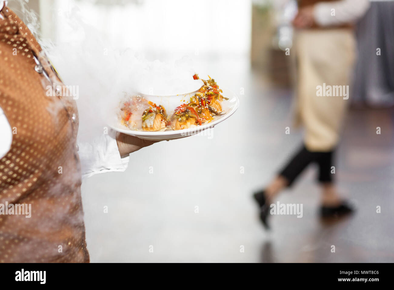 Carrying plates of food hi-res stock photography and images - Alamy