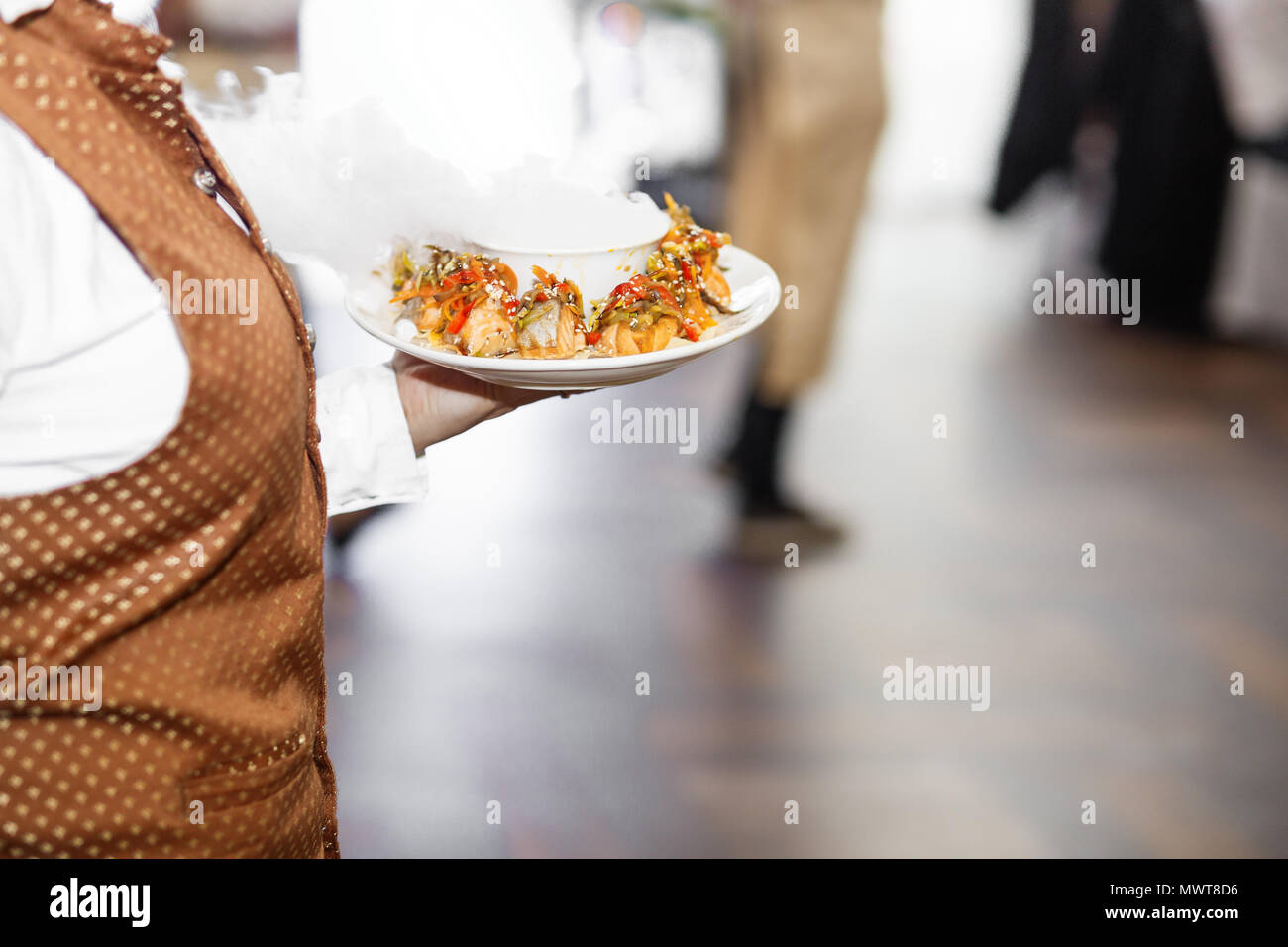 Restaurant waiter carrying plates food hi-res stock photography and ...