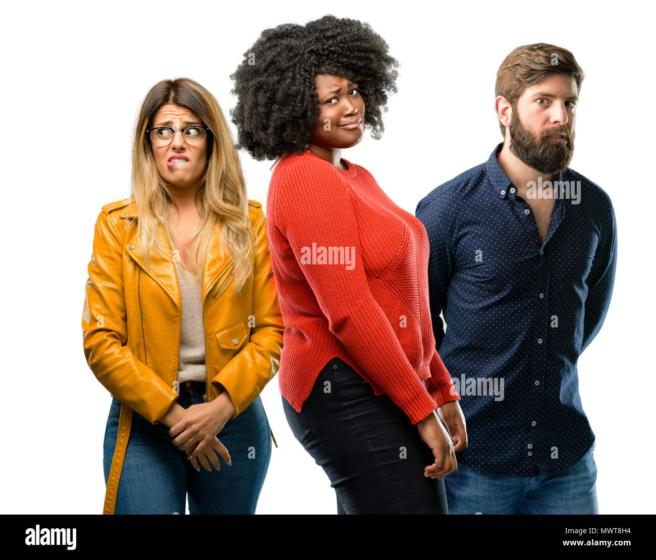 Group of three young men and women doubt expression, confuse and wonder ...