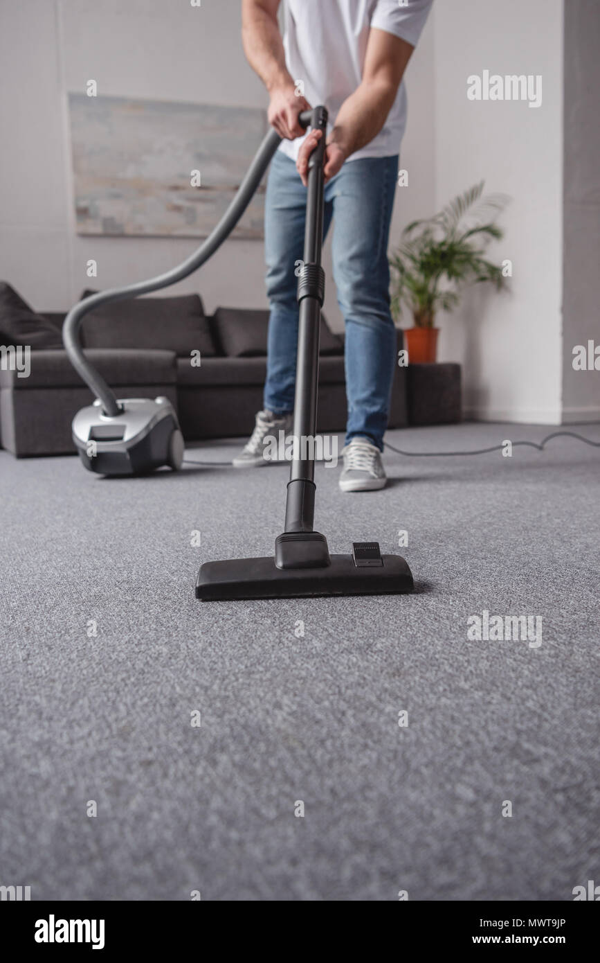 Man vacuuming carpet hi-res stock photography and images - Alamy