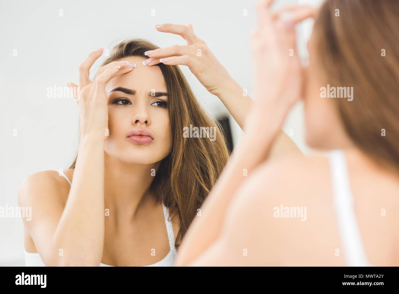 Woman Checking Skin High Resolution Stock Photography and Images - Alamy