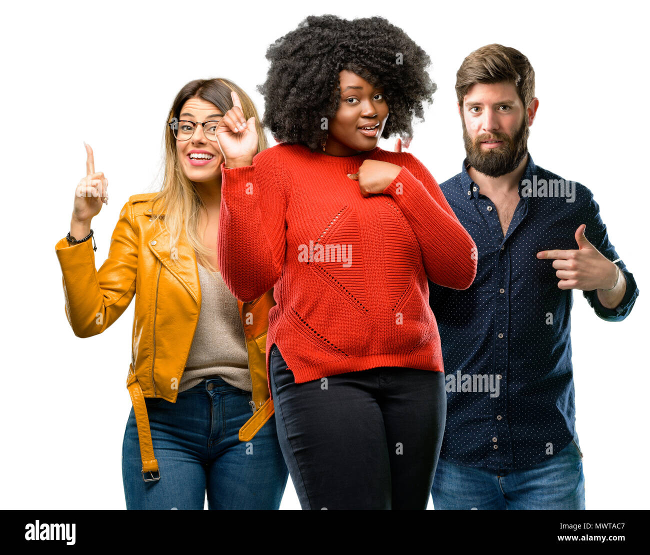 Group of three young men and women happy and surprised cheering ...